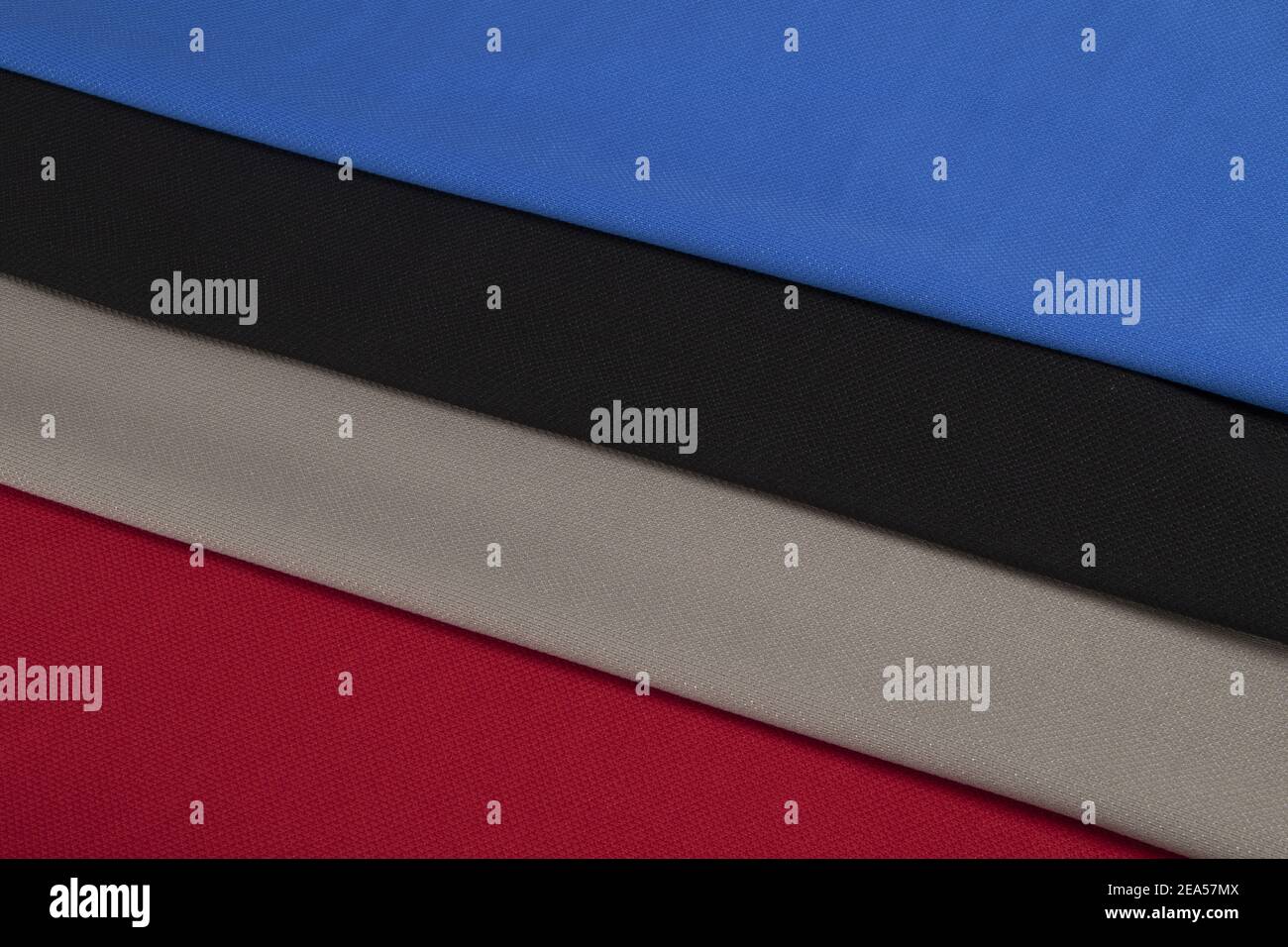 A closeup of folded natural and colorful fabric textures Stock Photo ...