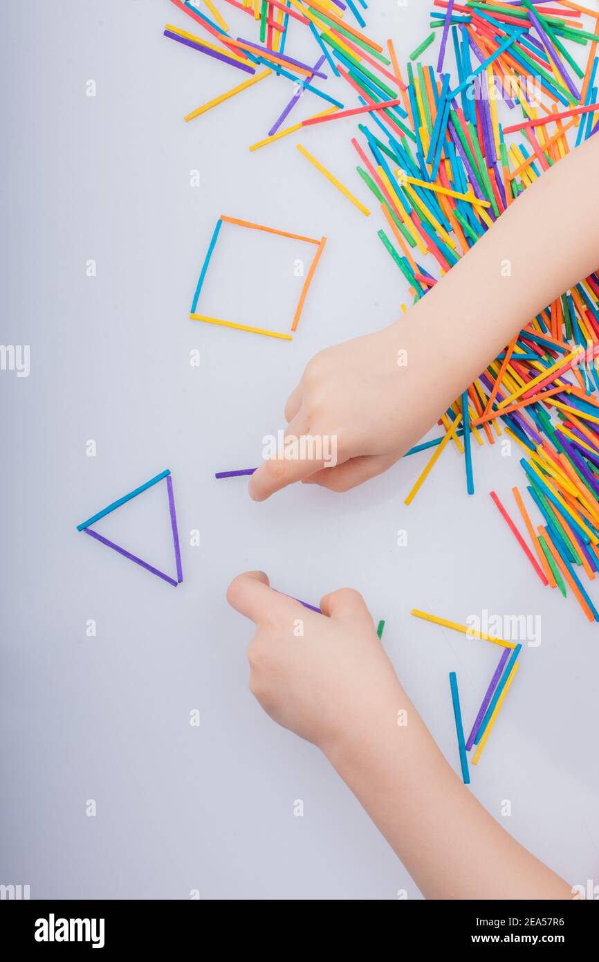 Kid making triangle and rectangular shape as creative concept Stock ...