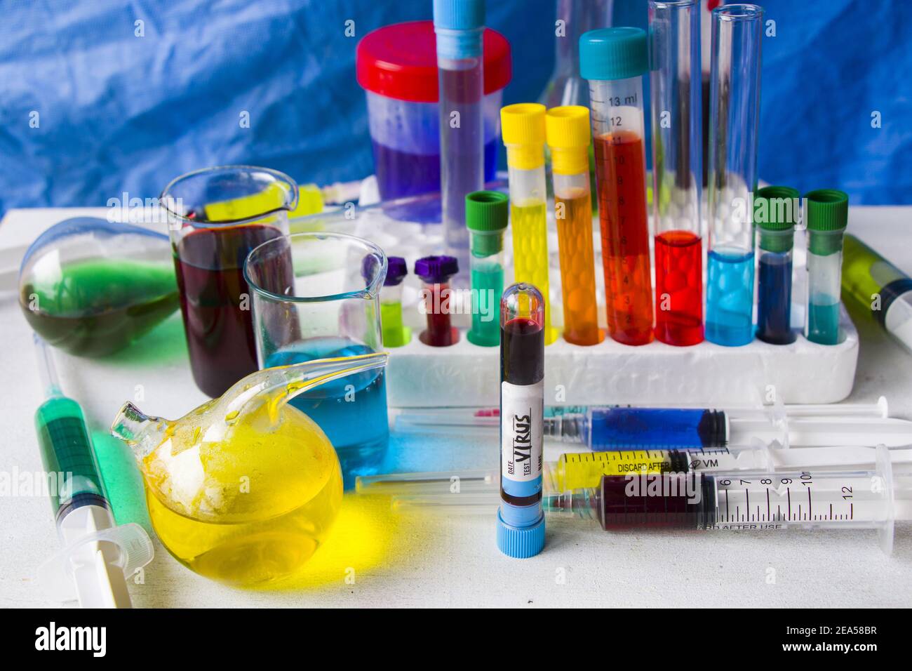 A closeup of laboratory blood test tubes and glassware with reagents ...