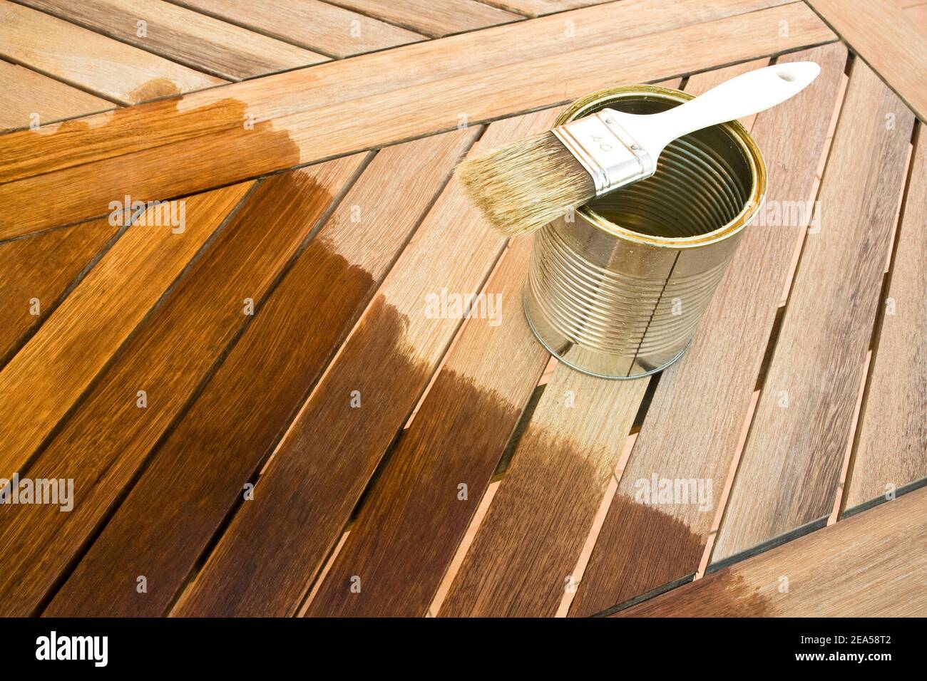 Staining wooden table. Before and after Stock Photo - Alamy