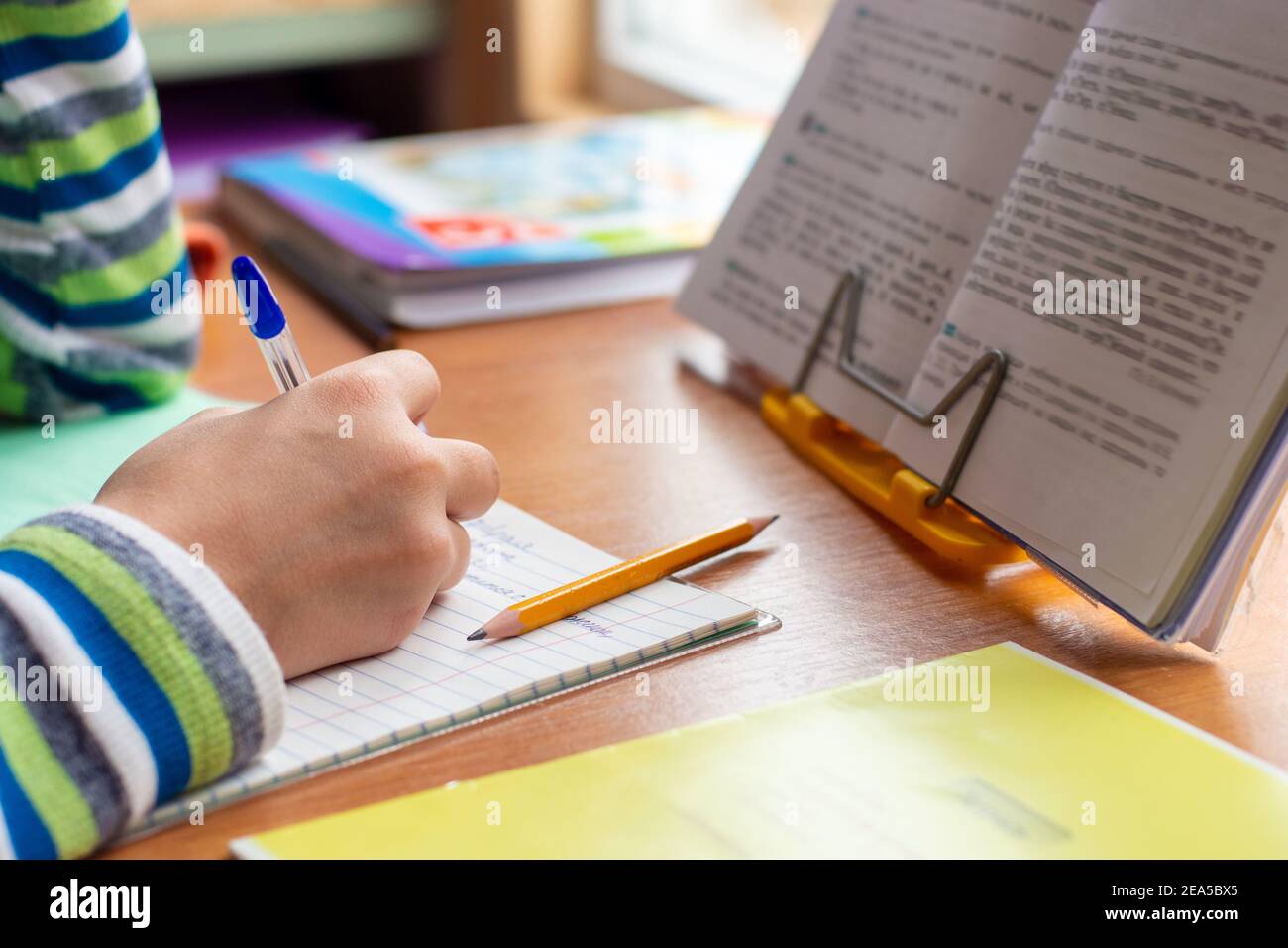 Schoolboy doing homework hi-res stock photography and images - Alamy