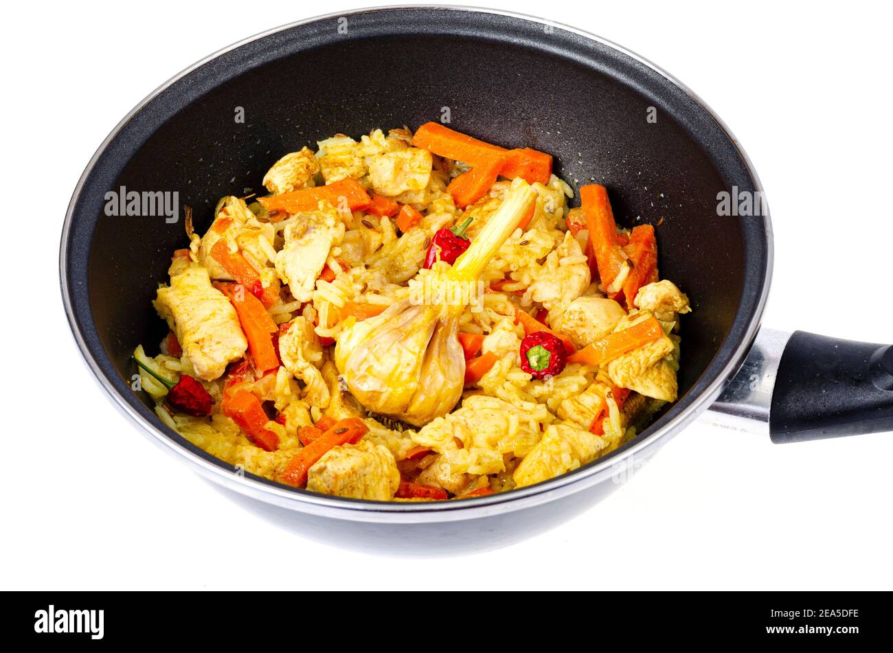 Pilaf. Rice with meat and vegetables in frying pan on white background ...