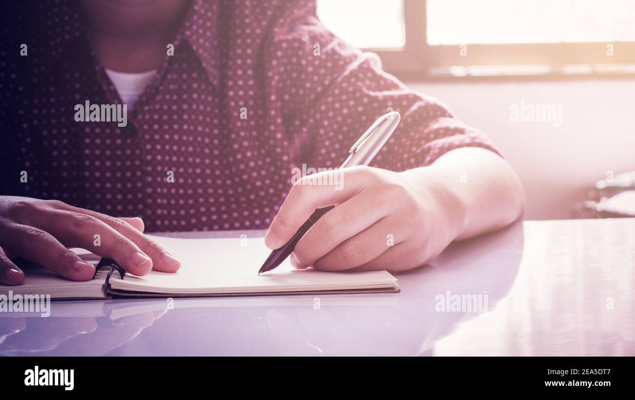 hand write with hand left Stock Photo - Alamy