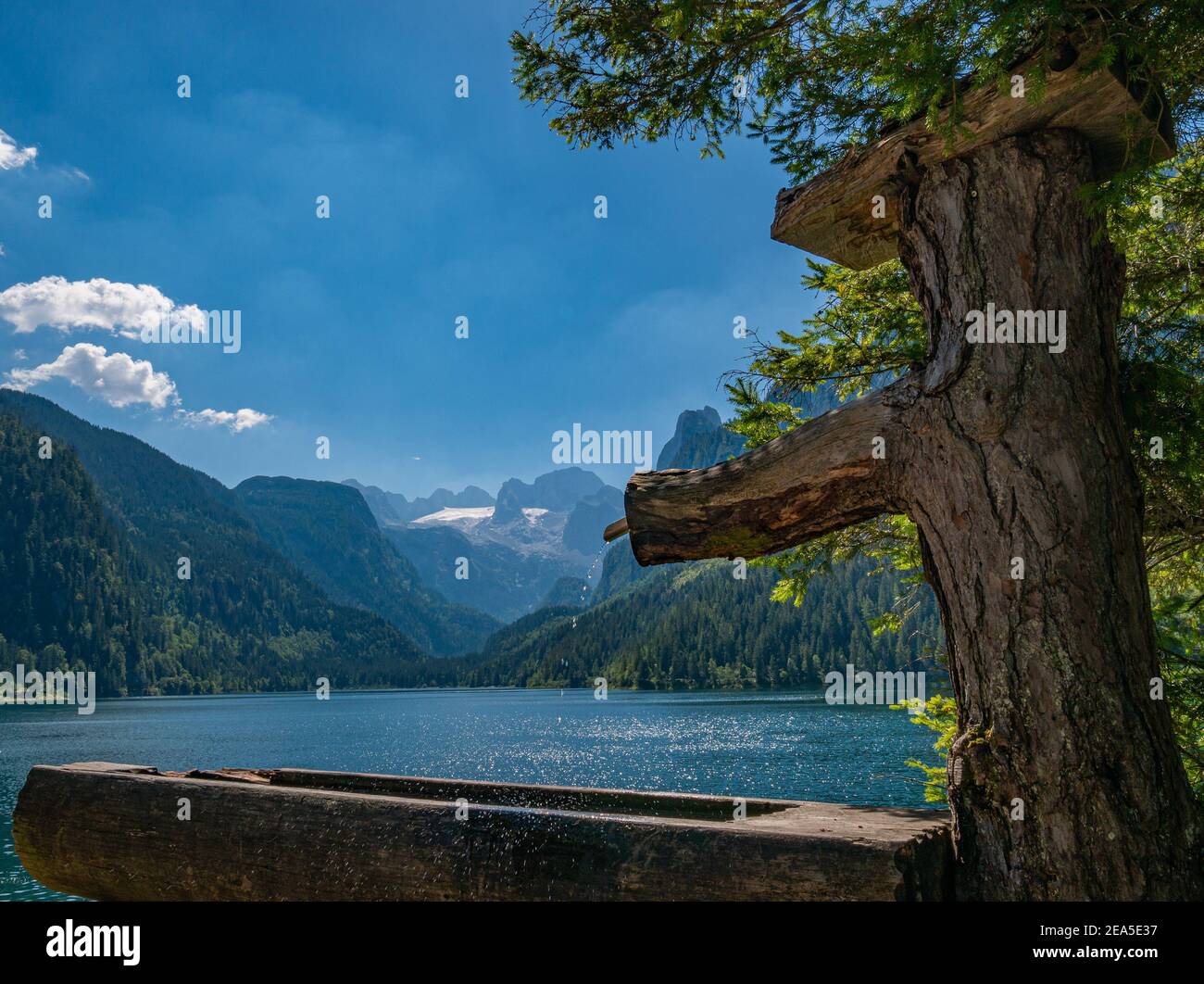 A beautiful water trough on a mountain lake with alpine panorama Stock ...