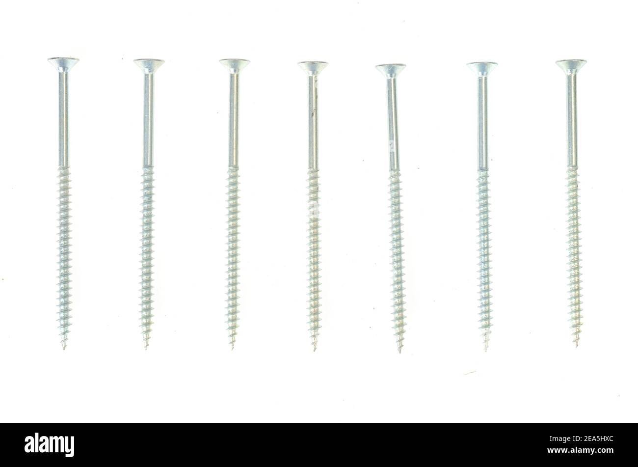 New metal screws for wood isolated on white background. Construction ...