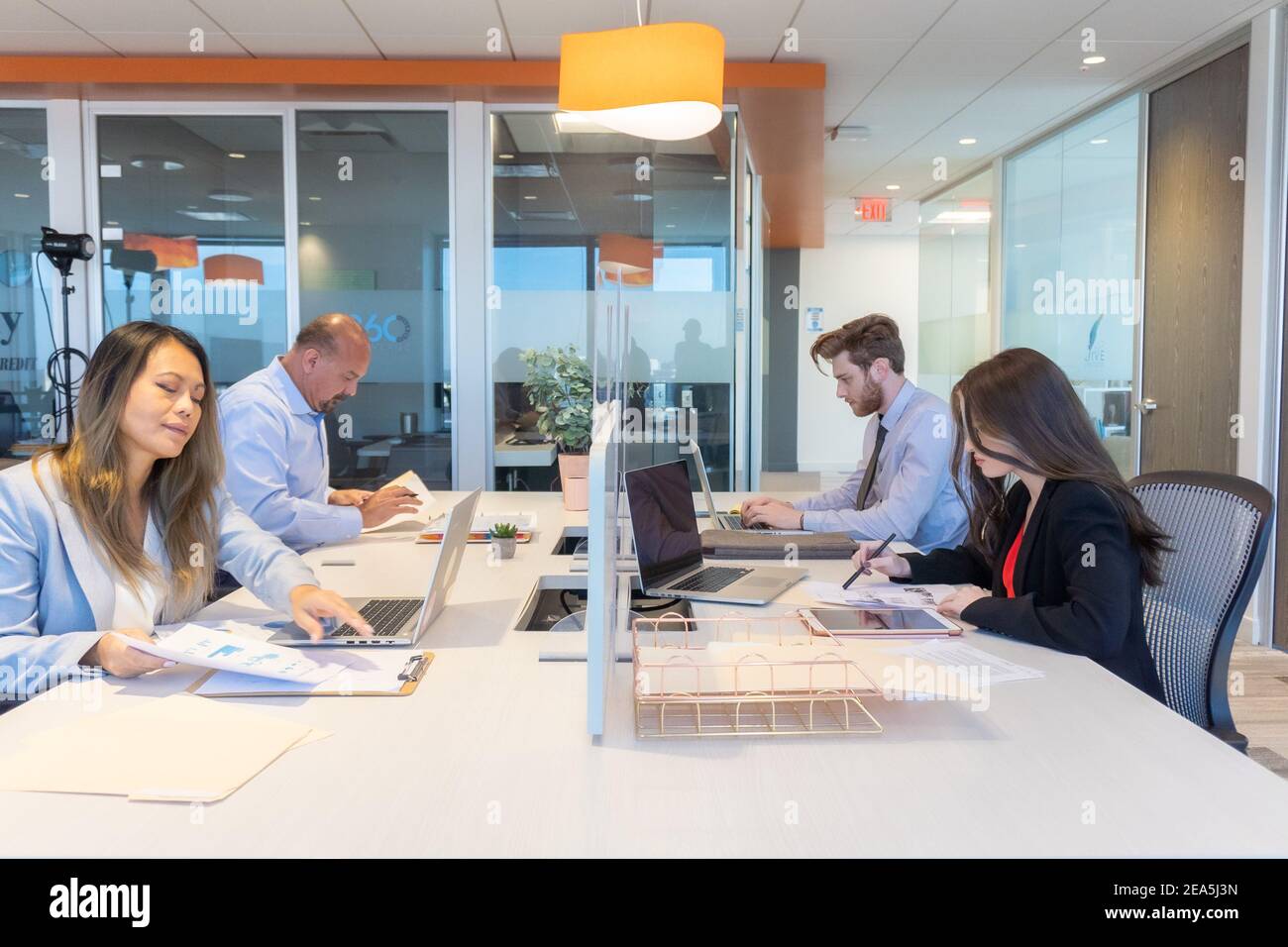 Office employee having a meeting with their team Stock Photo - Alamy
