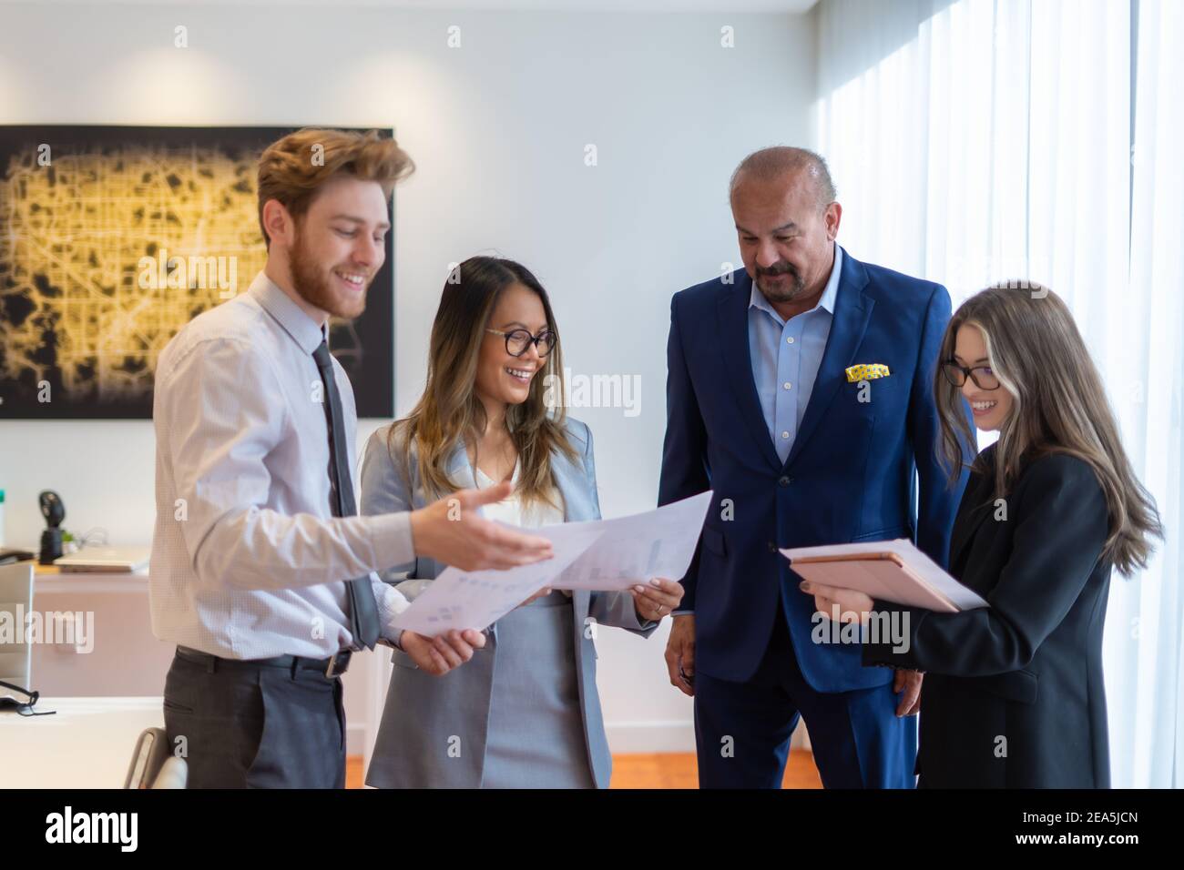 Office employee having a meeting with their team Stock Photo - Alamy