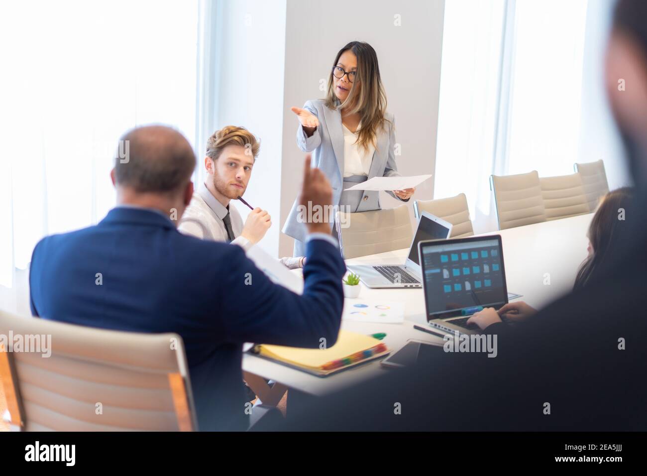 Office employee having a meeting with their team Stock Photo - Alamy