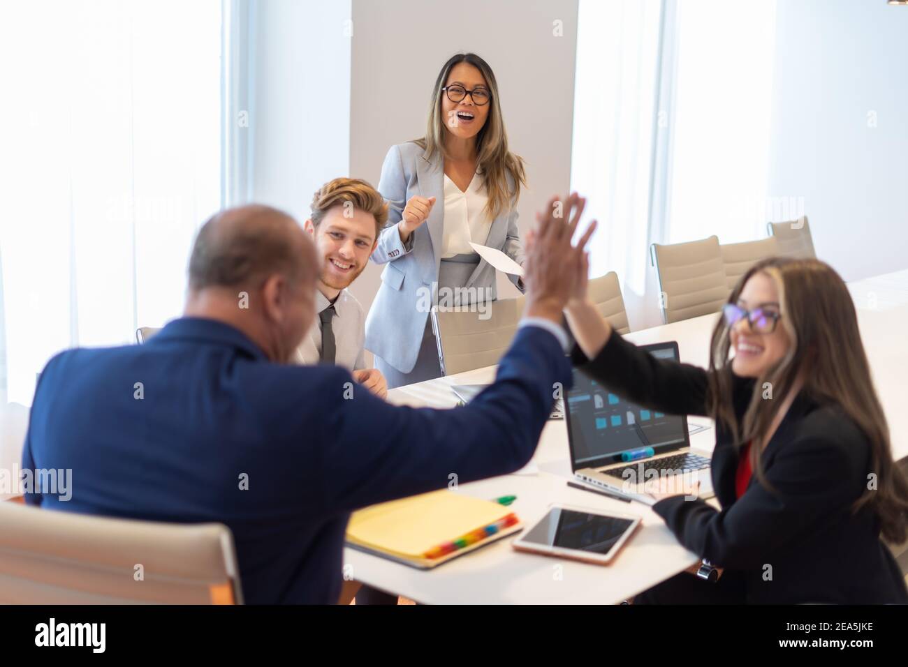 Office employee having a meeting with their team Stock Photo - Alamy
