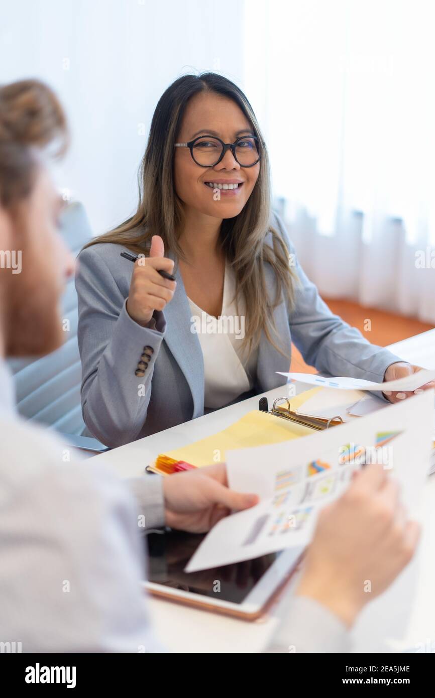 Office employee having a meeting with their team Stock Photo - Alamy