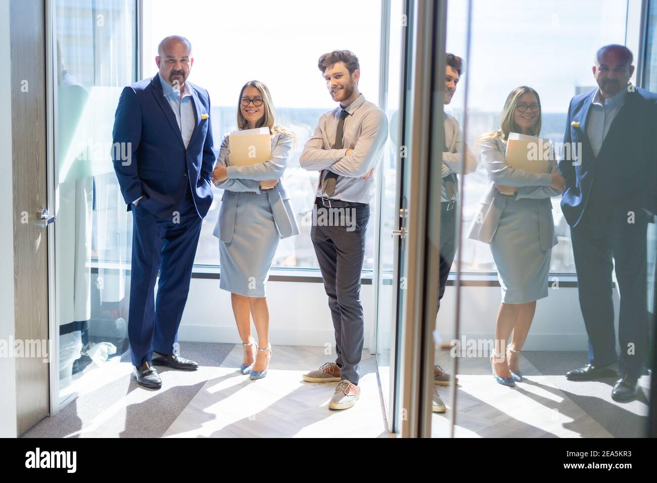 Office employee having a meeting with their team Stock Photo - Alamy