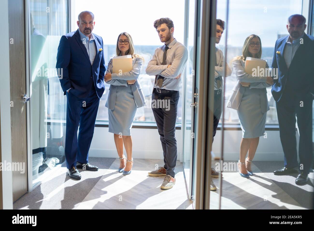 Office employee having a meeting with their team Stock Photo - Alamy