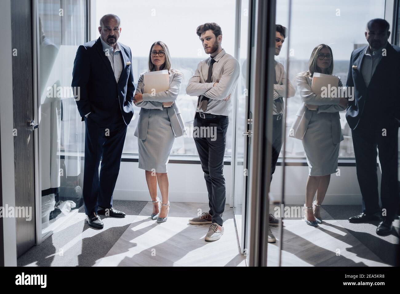 Office employee having a meeting with their team Stock Photo - Alamy