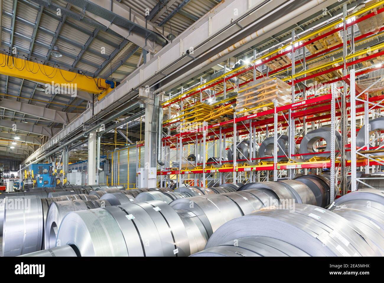 Tiered rack with sheet metal rolls. Internal warehouse of raw materials ...