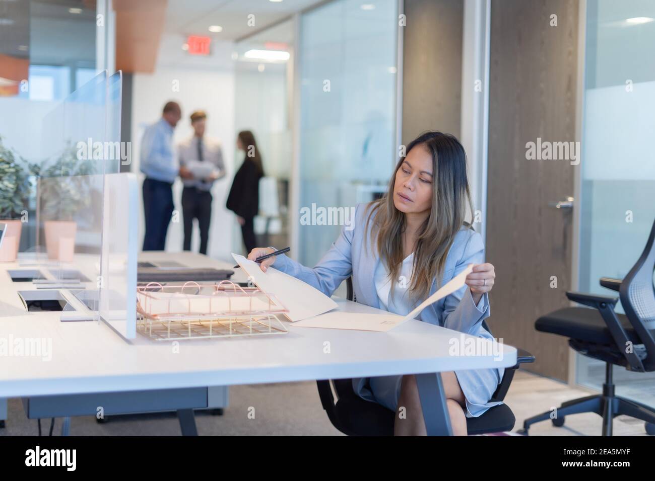 Office employee having a meeting with their team Stock Photo - Alamy