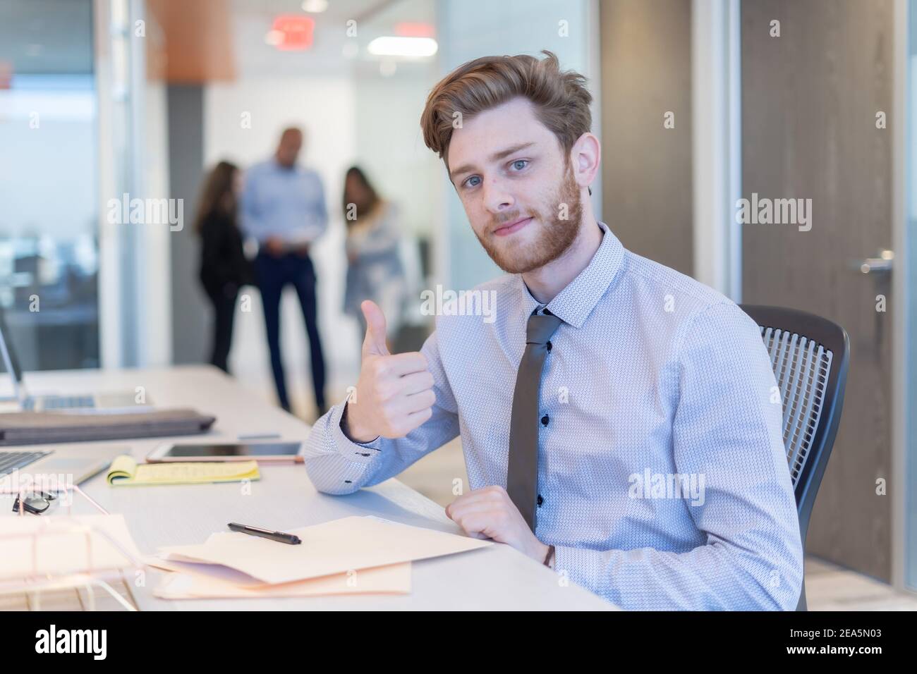 Office employee having a meeting with their team Stock Photo - Alamy