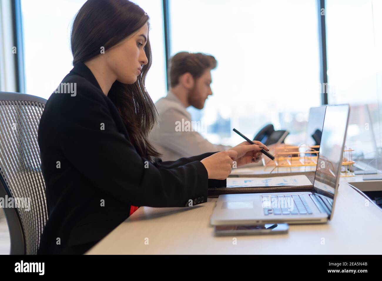 Office employee having a meeting with their team Stock Photo - Alamy