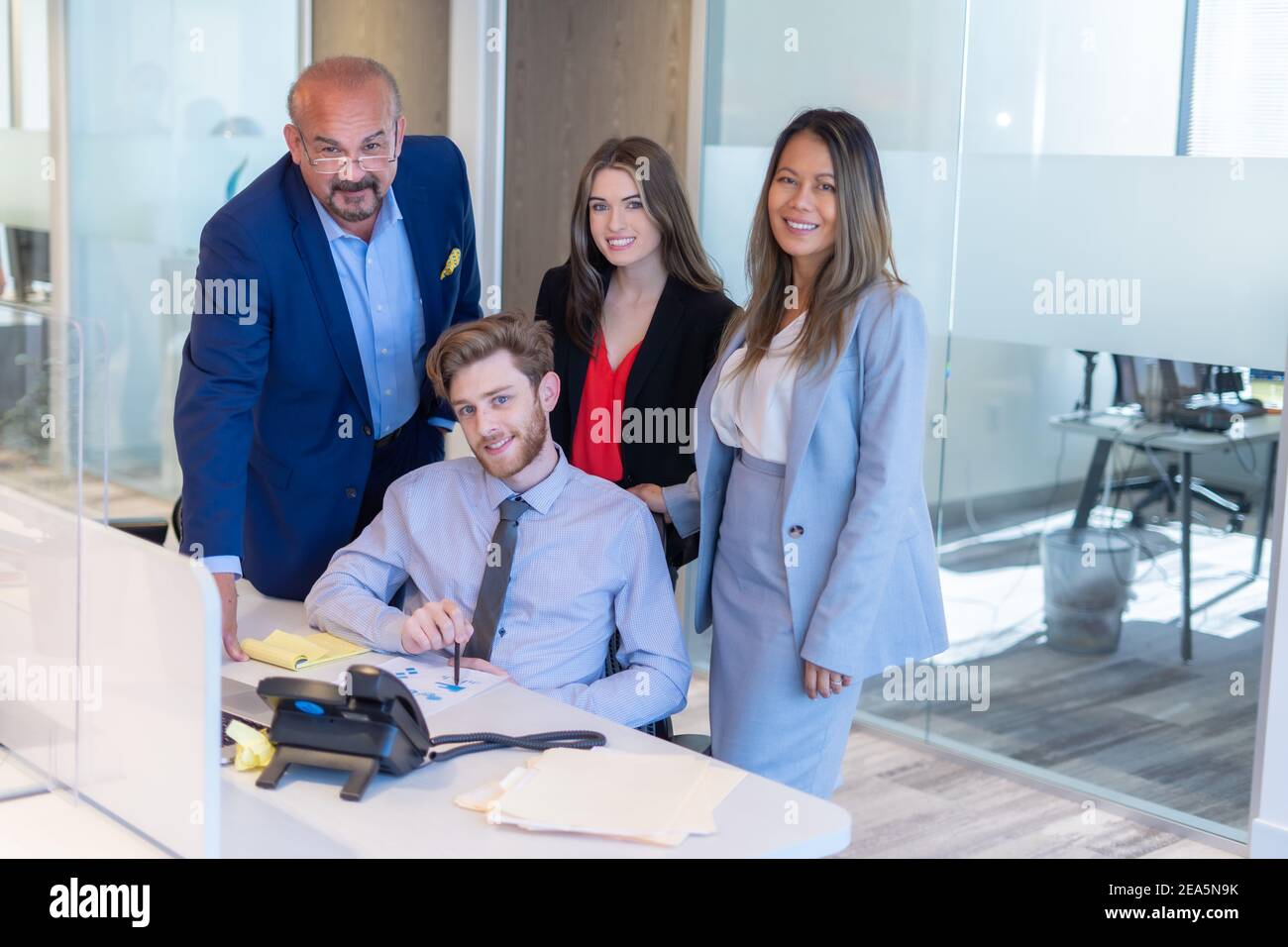 Office employee having a meeting with their team Stock Photo - Alamy