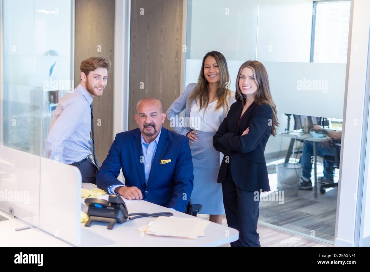 Office employee having a meeting with their team Stock Photo - Alamy