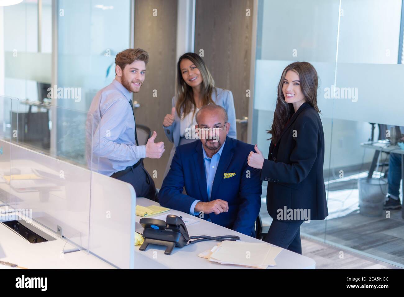 Office employee having a meeting with their team Stock Photo - Alamy