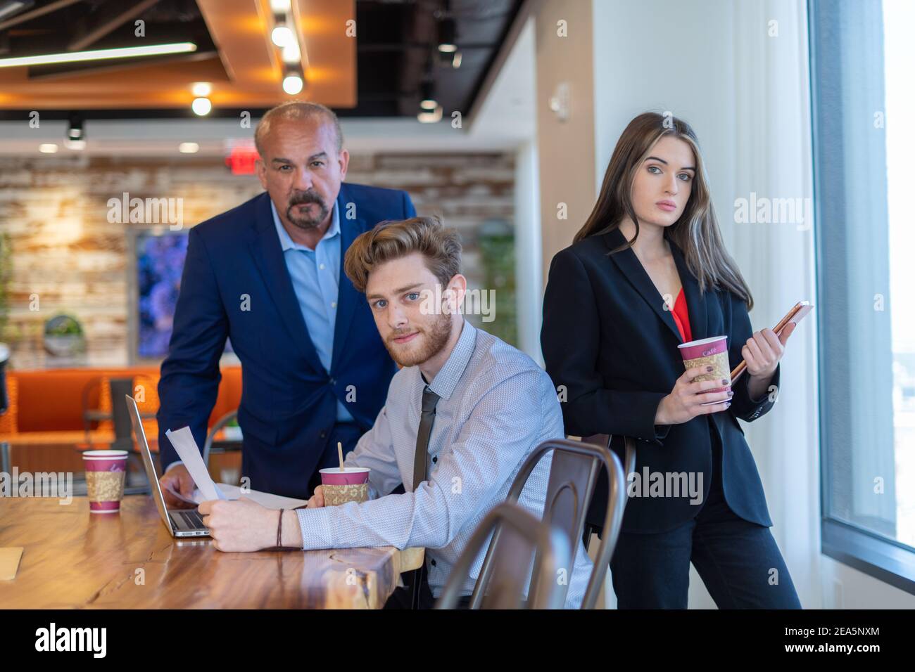 Office employee having a meeting with their team Stock Photo - Alamy