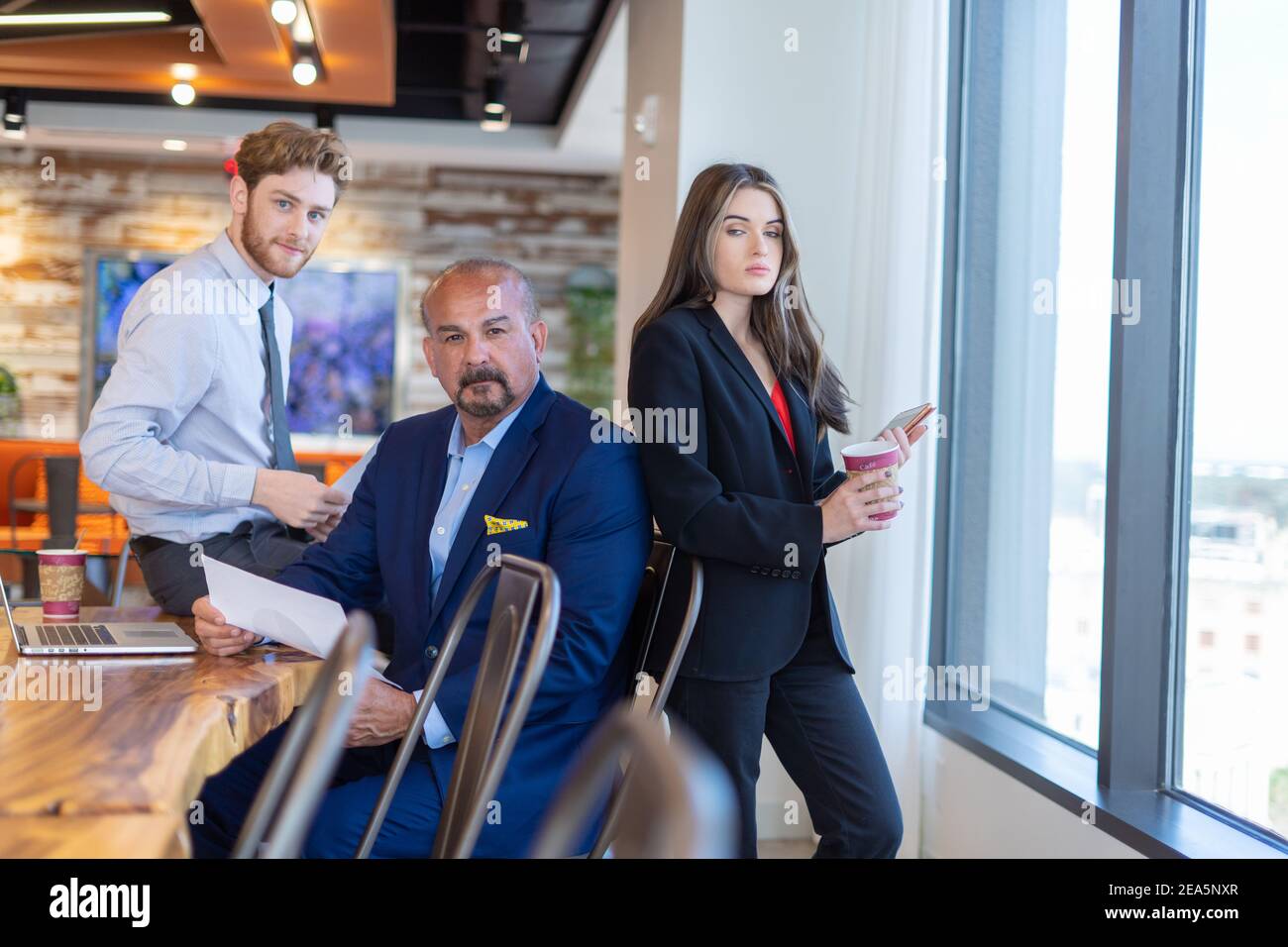 Office employee having a meeting with their team Stock Photo - Alamy