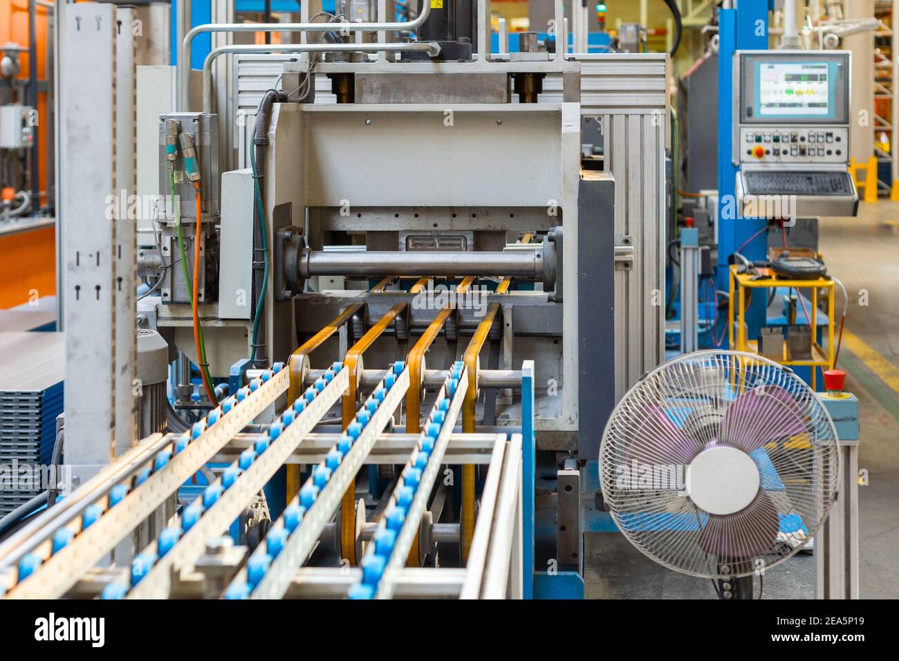 Roller forming machine. The interior of the plant producing a metal ...