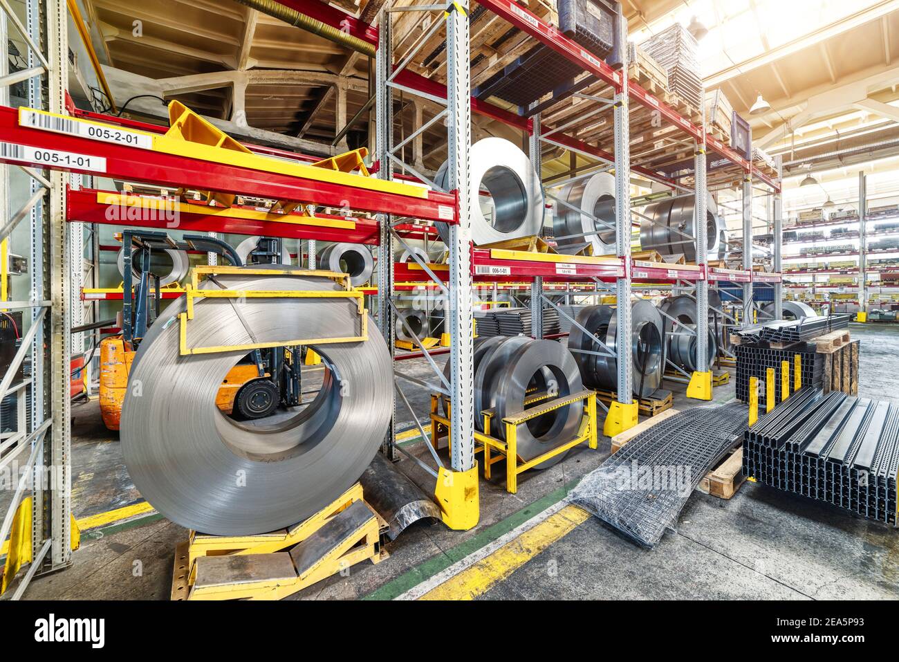 Factory stock wire. Wire spools lie on multi-tiered racks Stock Photo ...