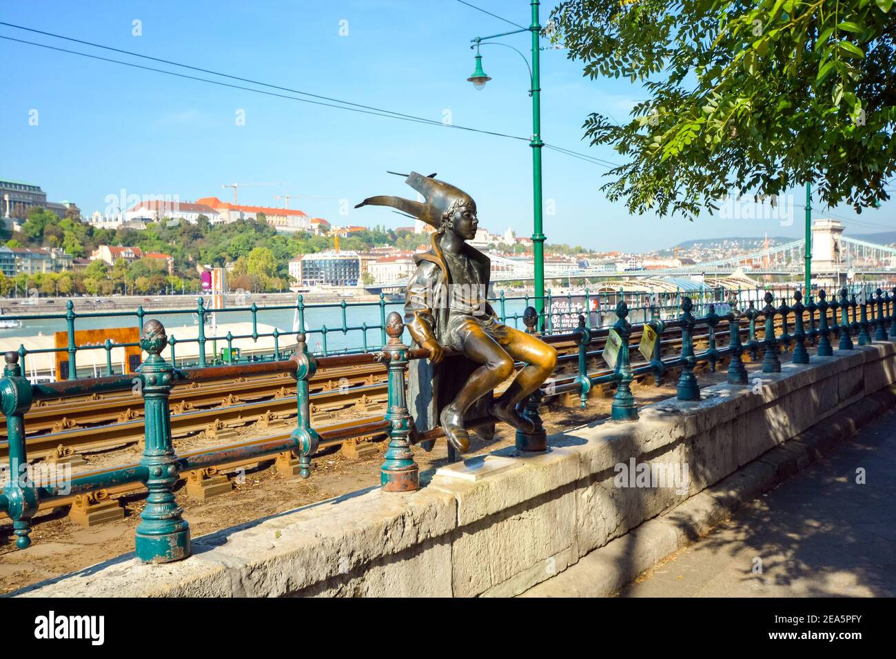 The statue of the Little Princess (Kiskirálylány) sitting on the railings of the Danube ...