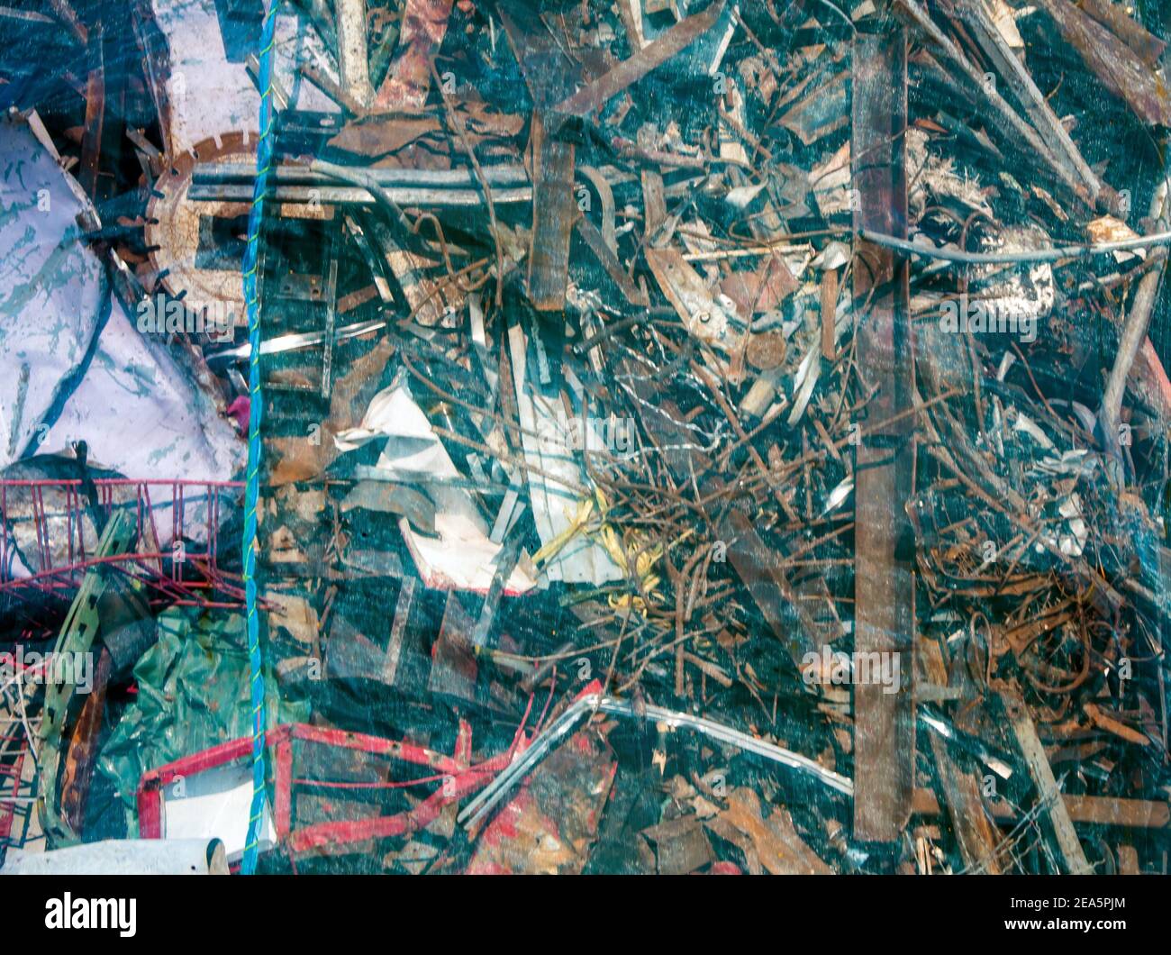 Scrap steel under the plastic net in the truck Stock Photo - Alamy