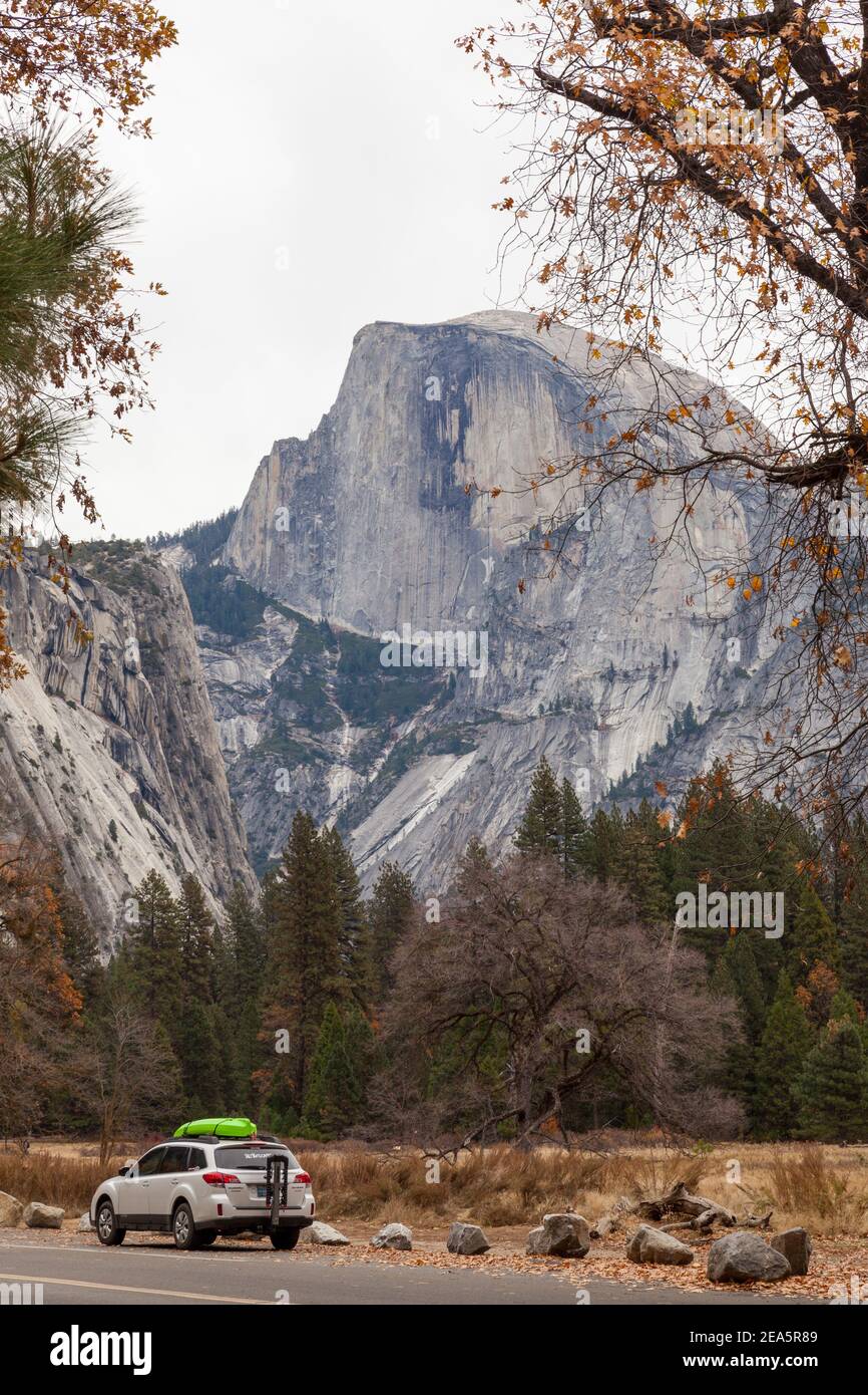 Suv car with cargo box parked on road side with beautiful autumnal ...
