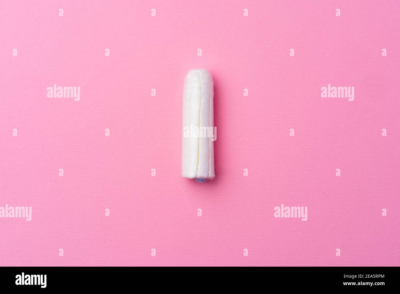 Hygienic female tampon on a pink background Stock Photo - Alamy