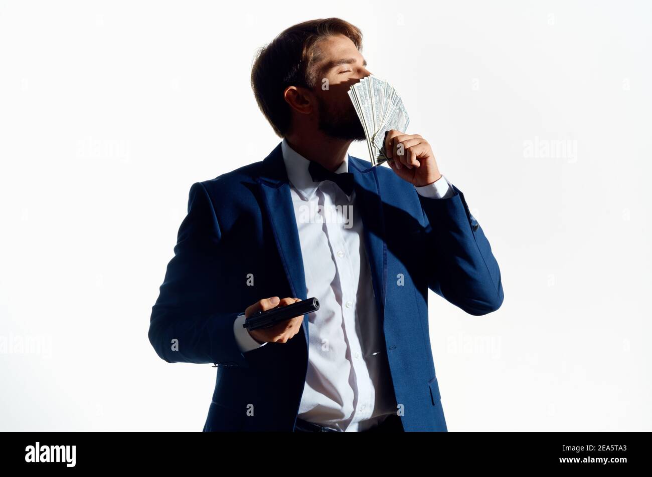 rich man with gun and wad of money classic suit white background Stock ...