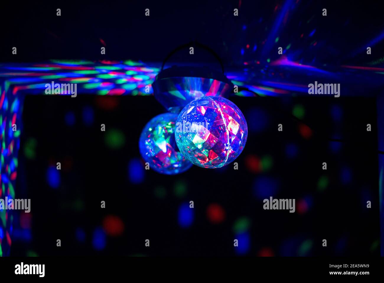 Disco lights illuminating in dark room Stock Photo - Alamy