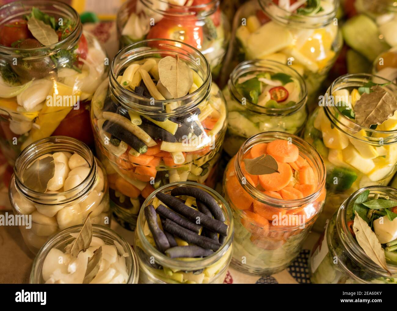 glass jars with various vegetables, canned vegetables, salting various ...