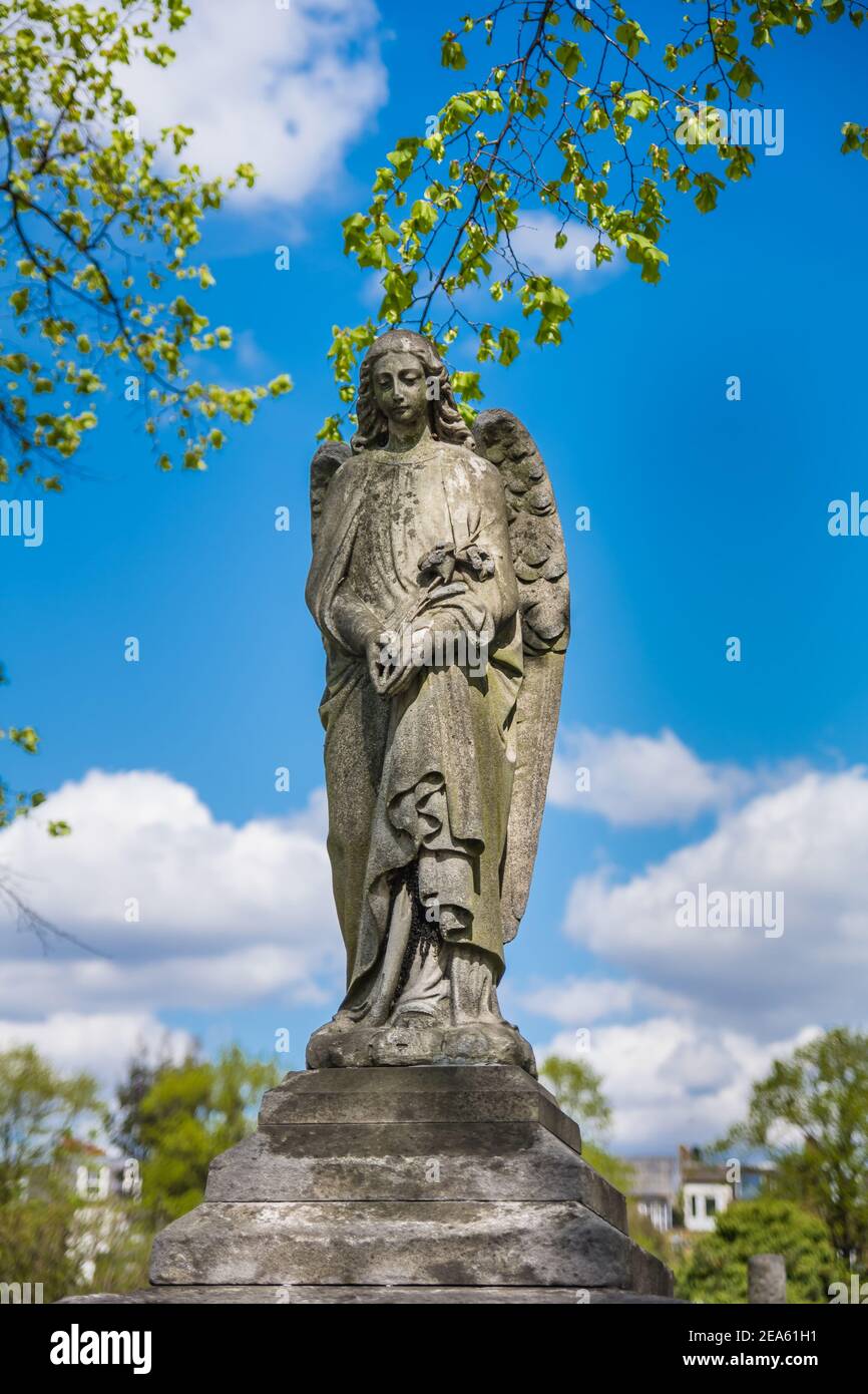 Angel statue with clouds hi-res stock photography and images - Alamy