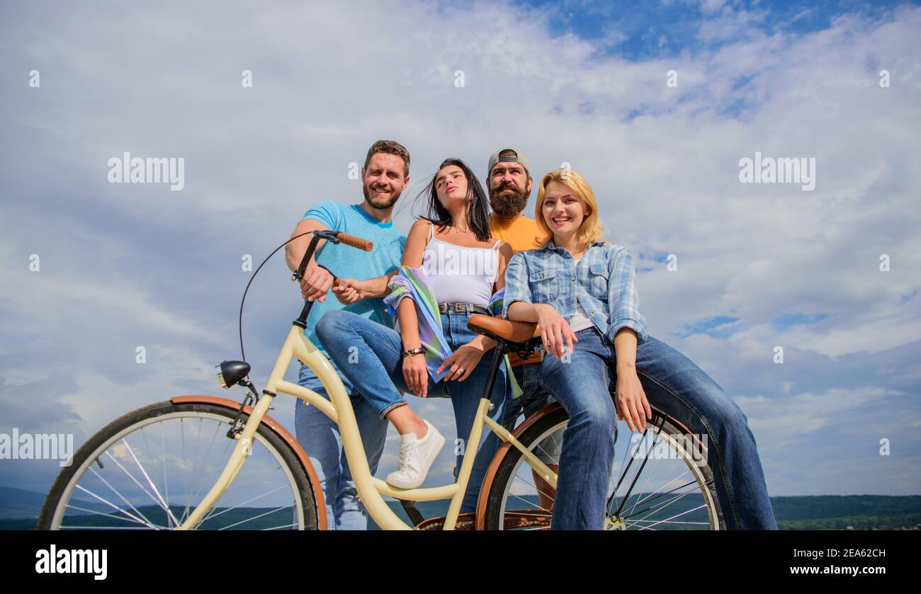 Group friends hang out with bicycle. Youth likes cruiser bike. Cycling ...