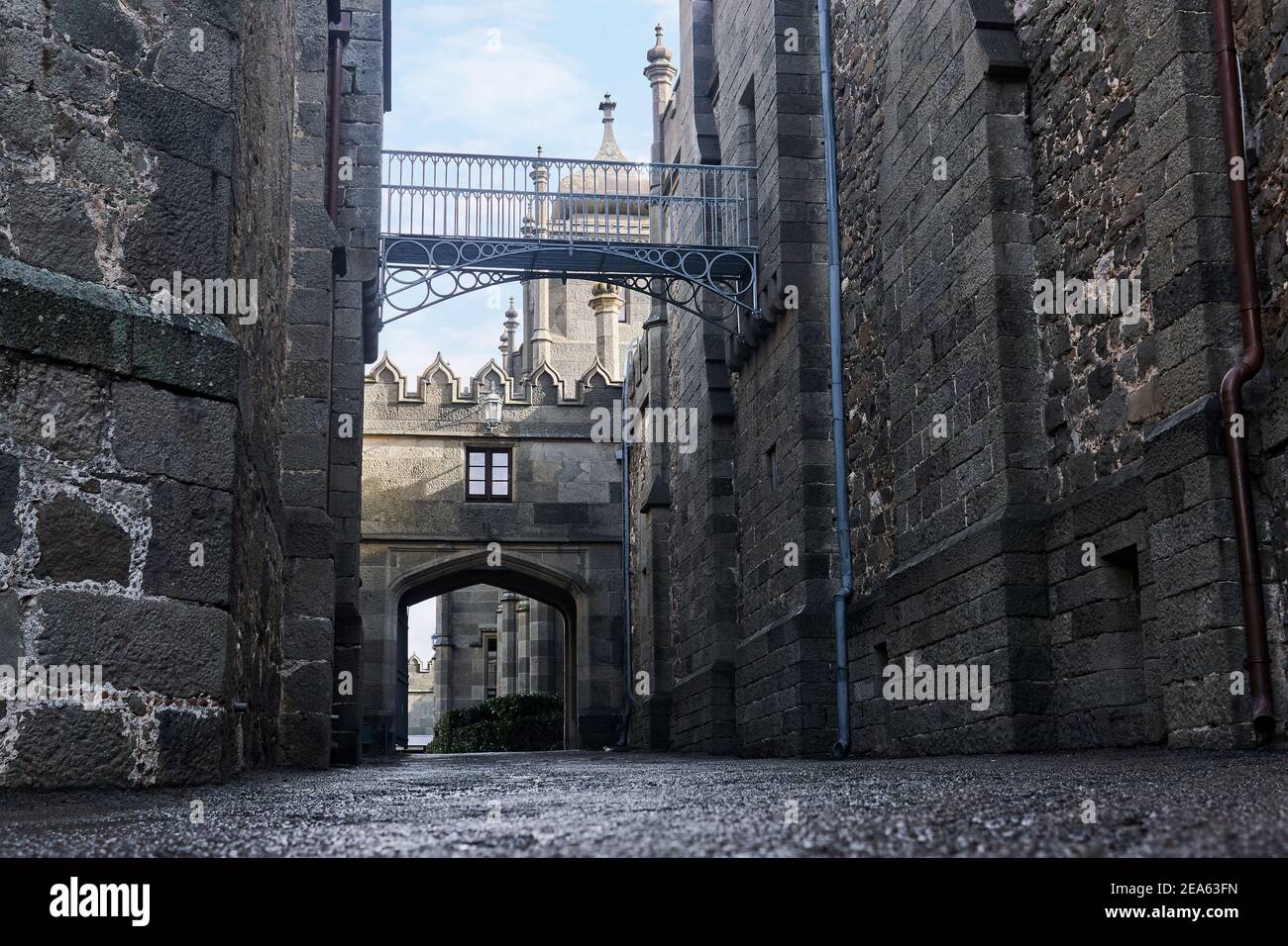 passage between the walls of an ancient castle, looking like a medieval ...