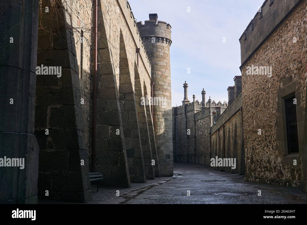 passage between the walls of an ancient castle, looking like a medieval ...