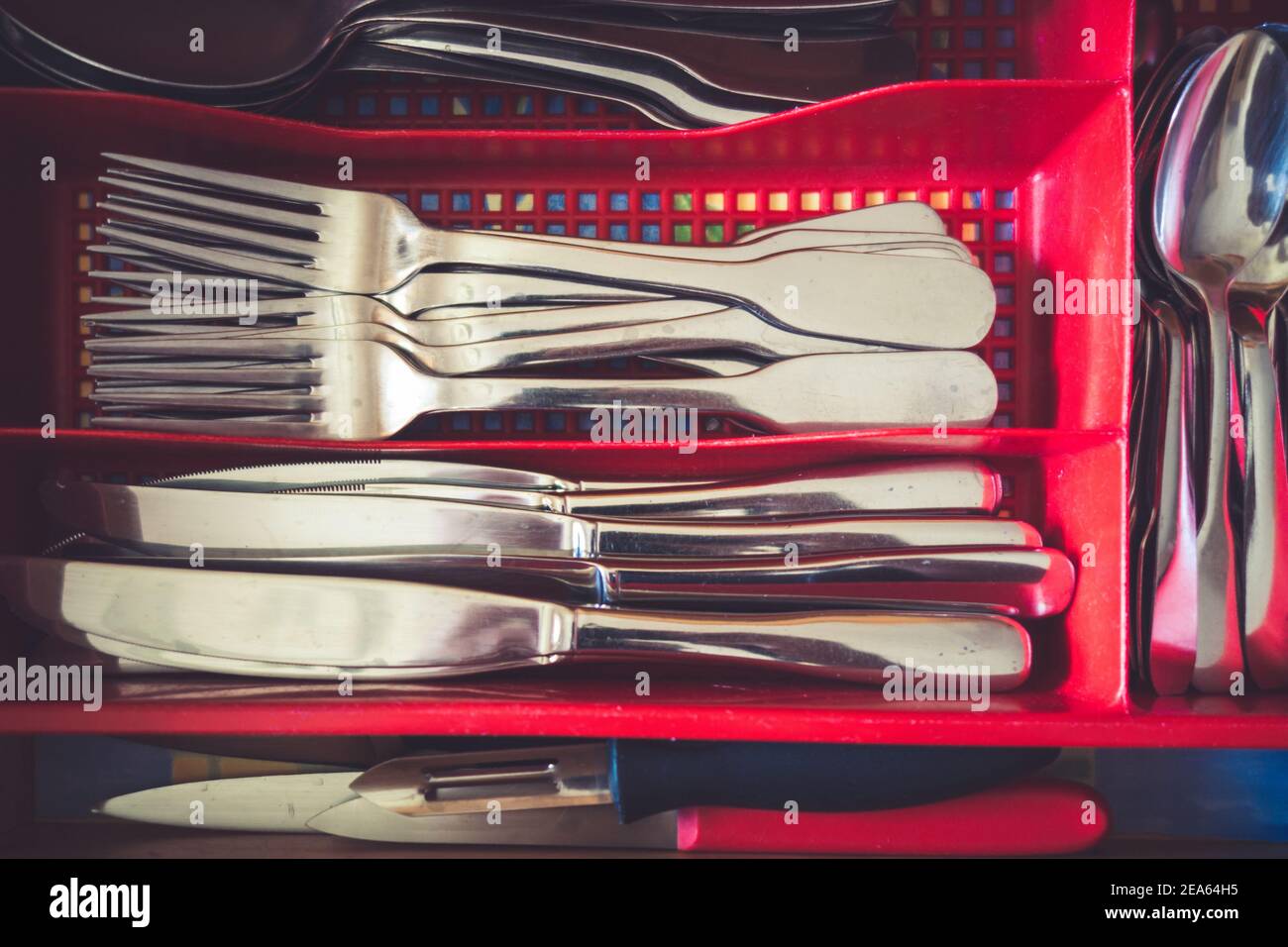 Cutlery in a kitchen drawer. Closeup view Stock Photo - Alamy