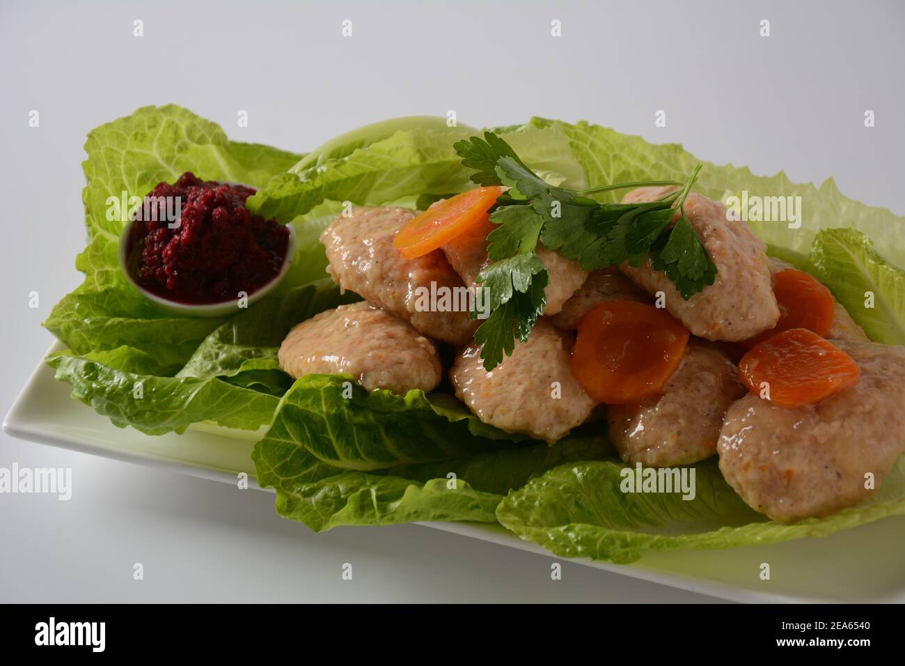 Gefilte fish with carrots, lettuce, horse radish . Passover traditional ...