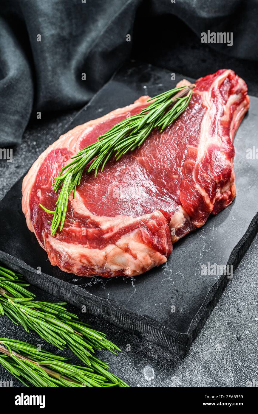 Rib eye or cowboy steak. Raw Marble beef black Angus, ribeye. Back ...