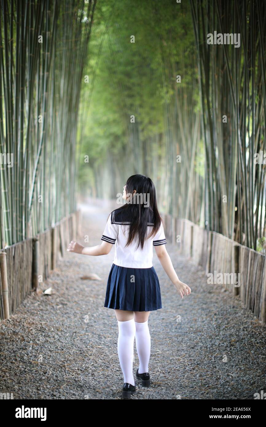Portrait of beautiful Asian japanese high school girl uniform looking ...