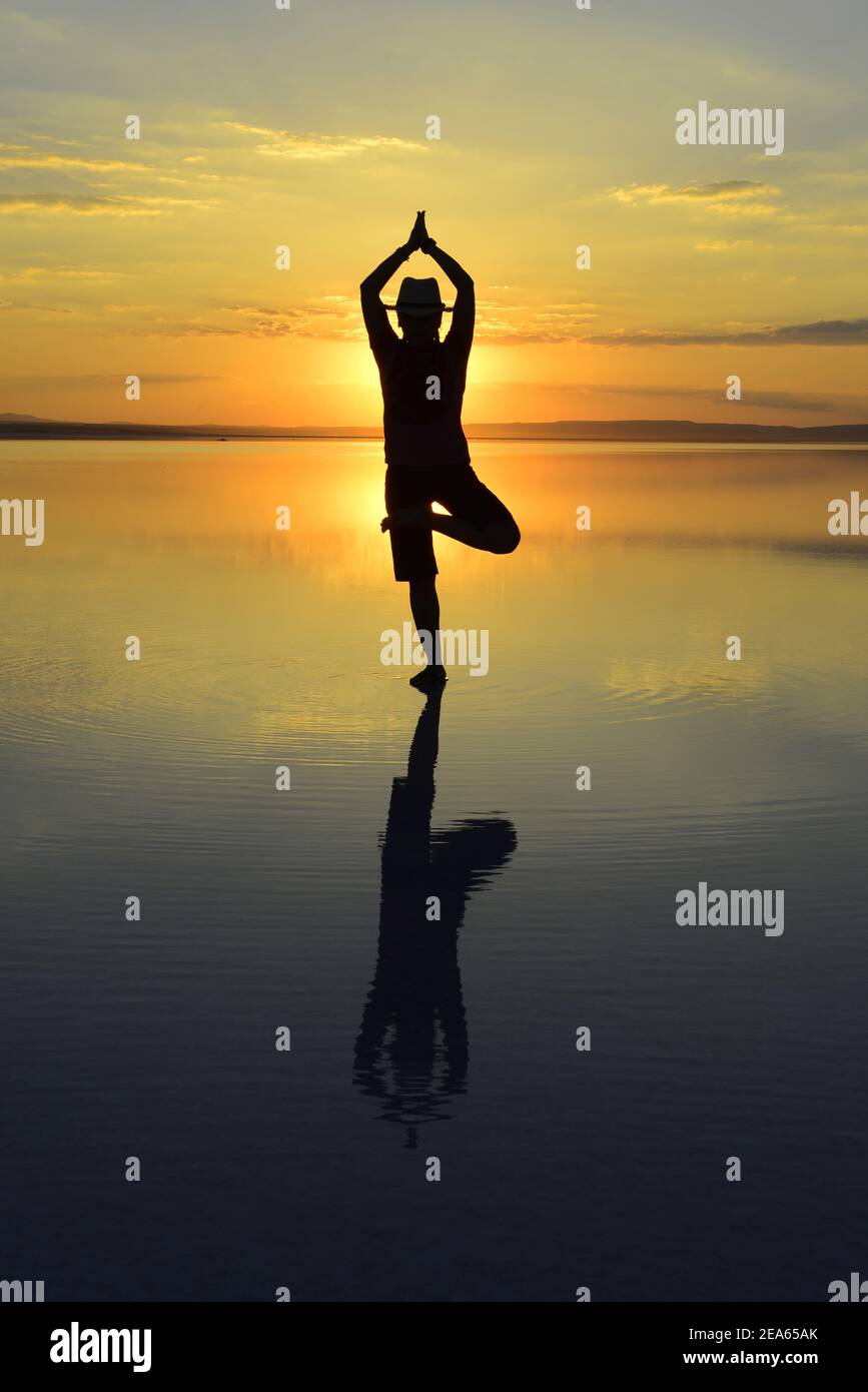 sunset meditation and reflection Stock Photo - Alamy