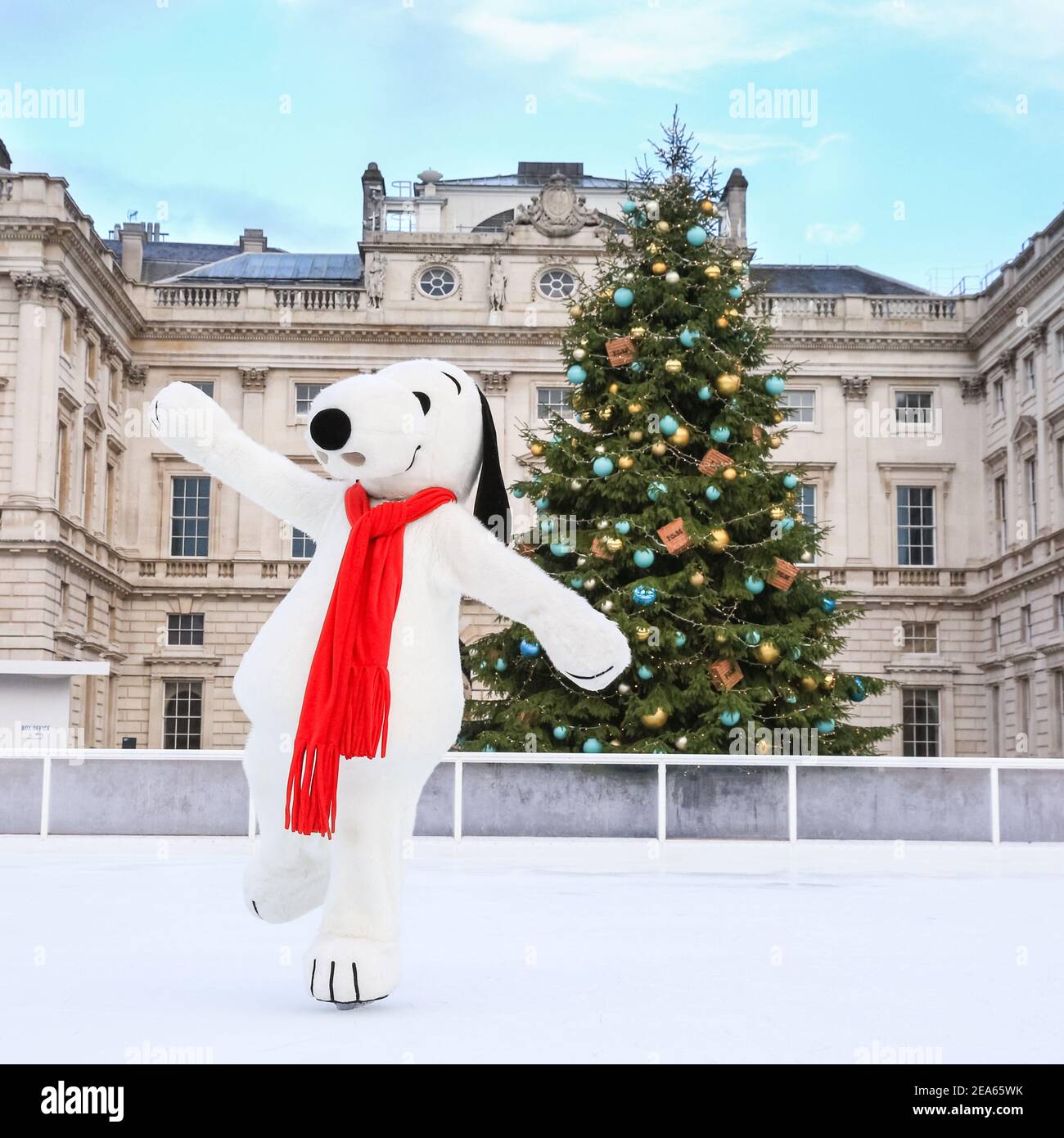 Snoopy, beagle character from the Peanuts skates on the ice to open ...