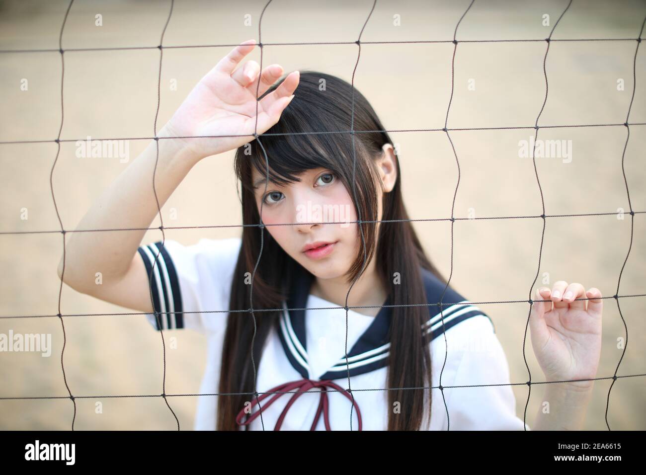 Portrait of beautiful Asian japanese high school girl uniform looking with net Stock Photo - Alamy