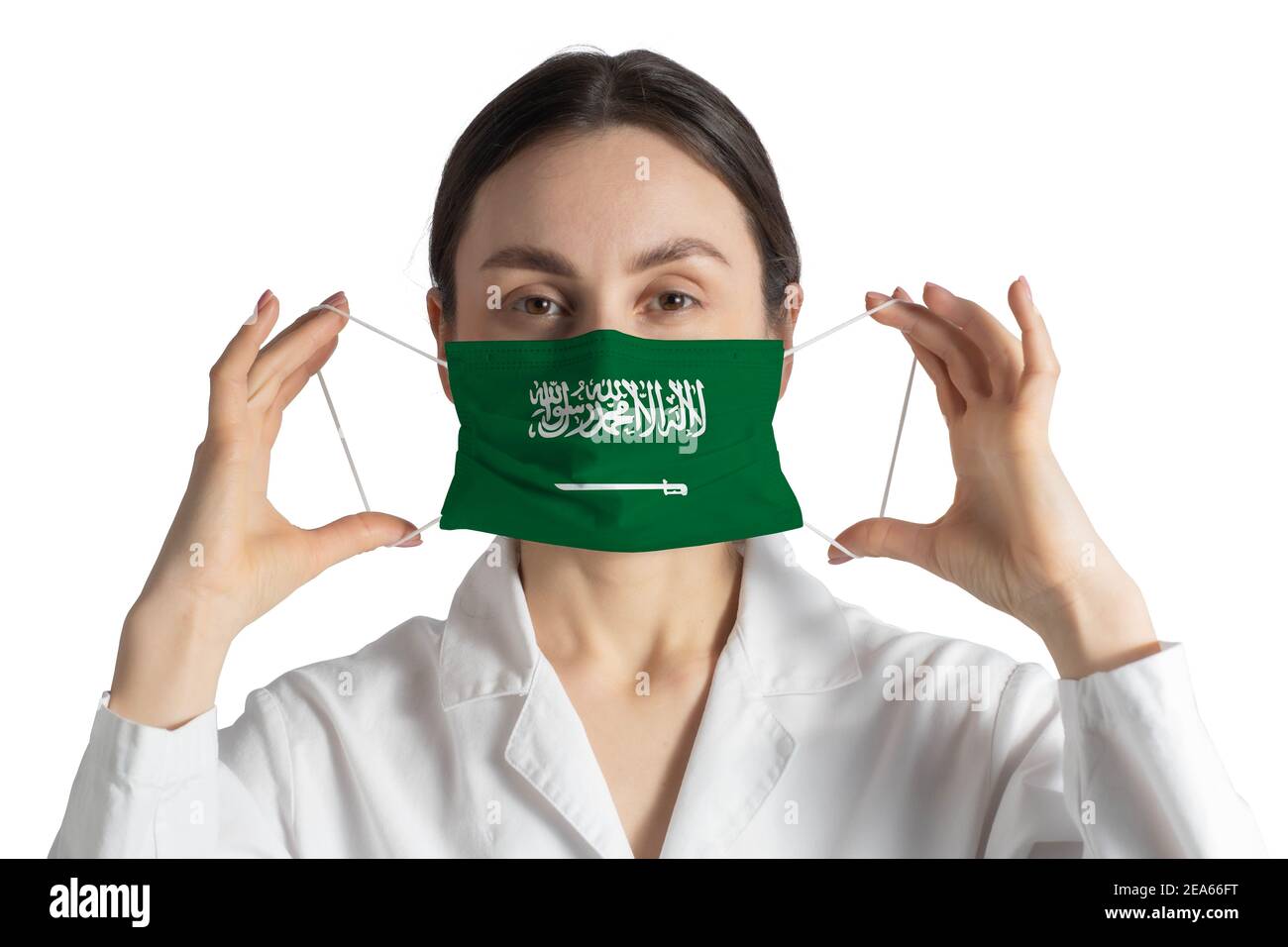 Respirator with flag of Saudi Arabia Doctor puts on medical face mask ...