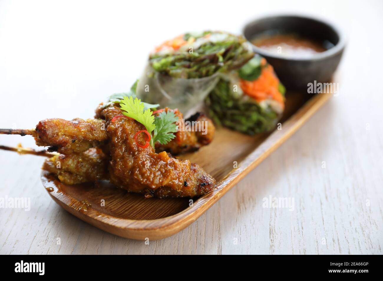 Chicken Satay on wood background Stock Photo - Alamy