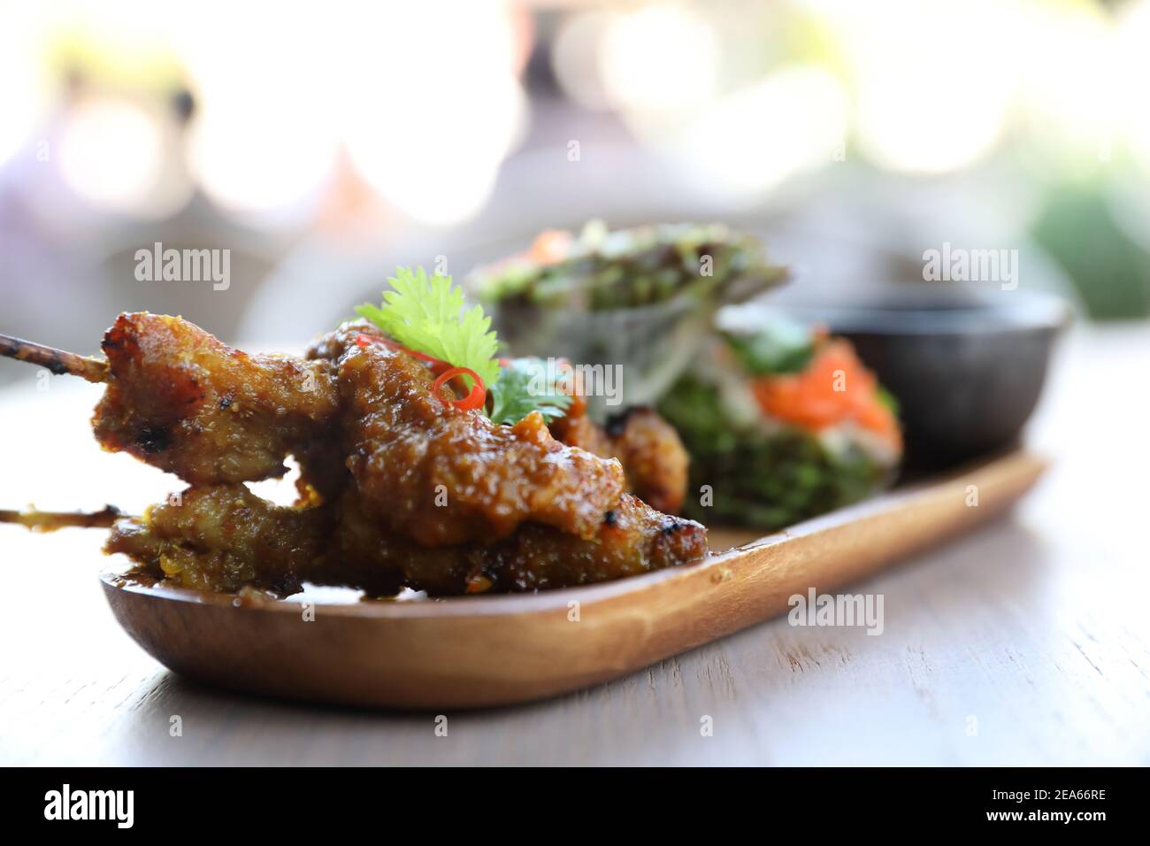 Chicken Satay on wood background Stock Photo - Alamy