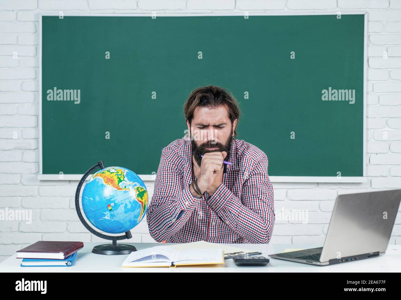 Sick teacher in the classroom hi-res stock photography and images - Alamy